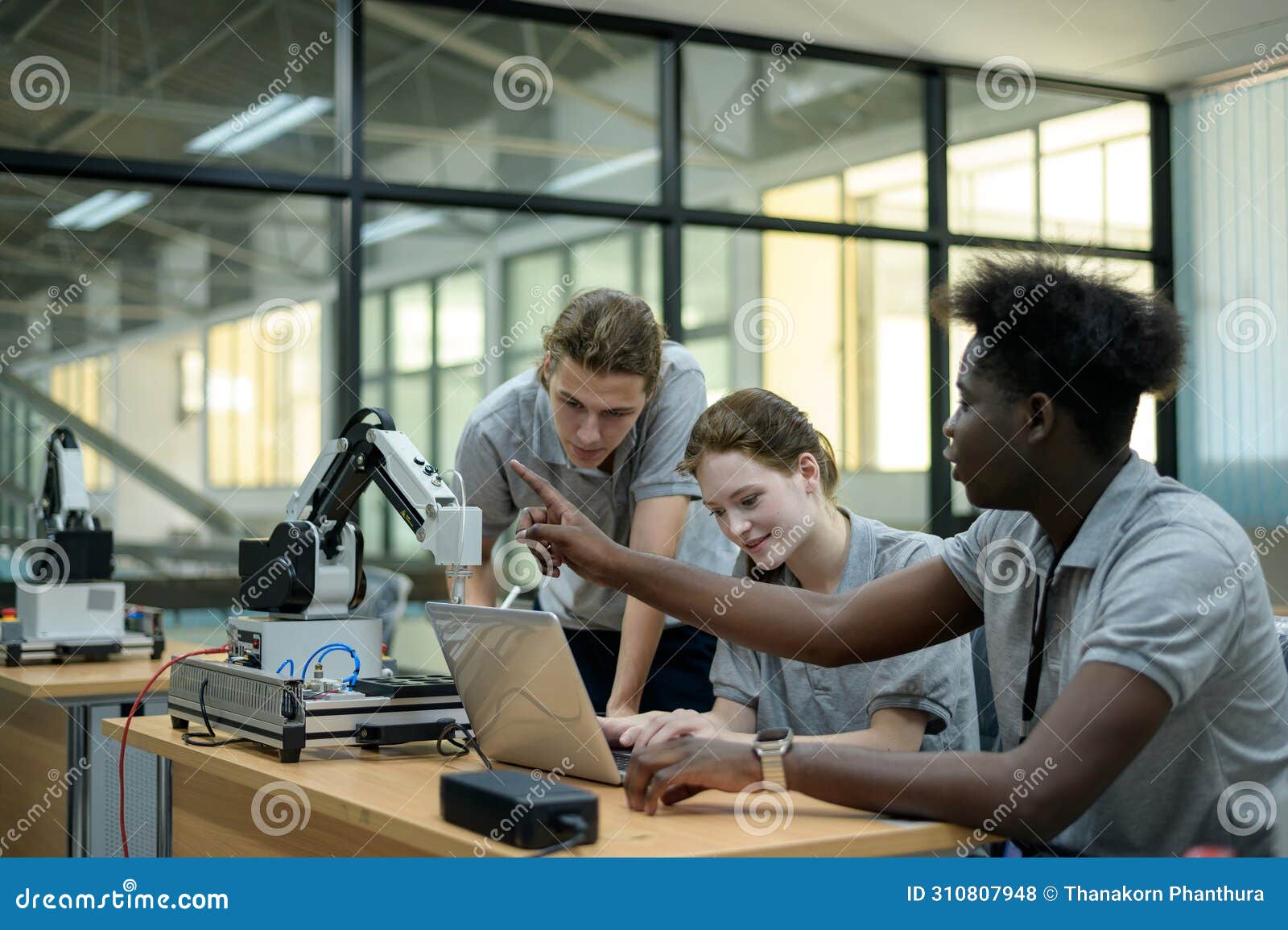 Trainee Robotics Engineer Learning with Programming and Manipulating ...