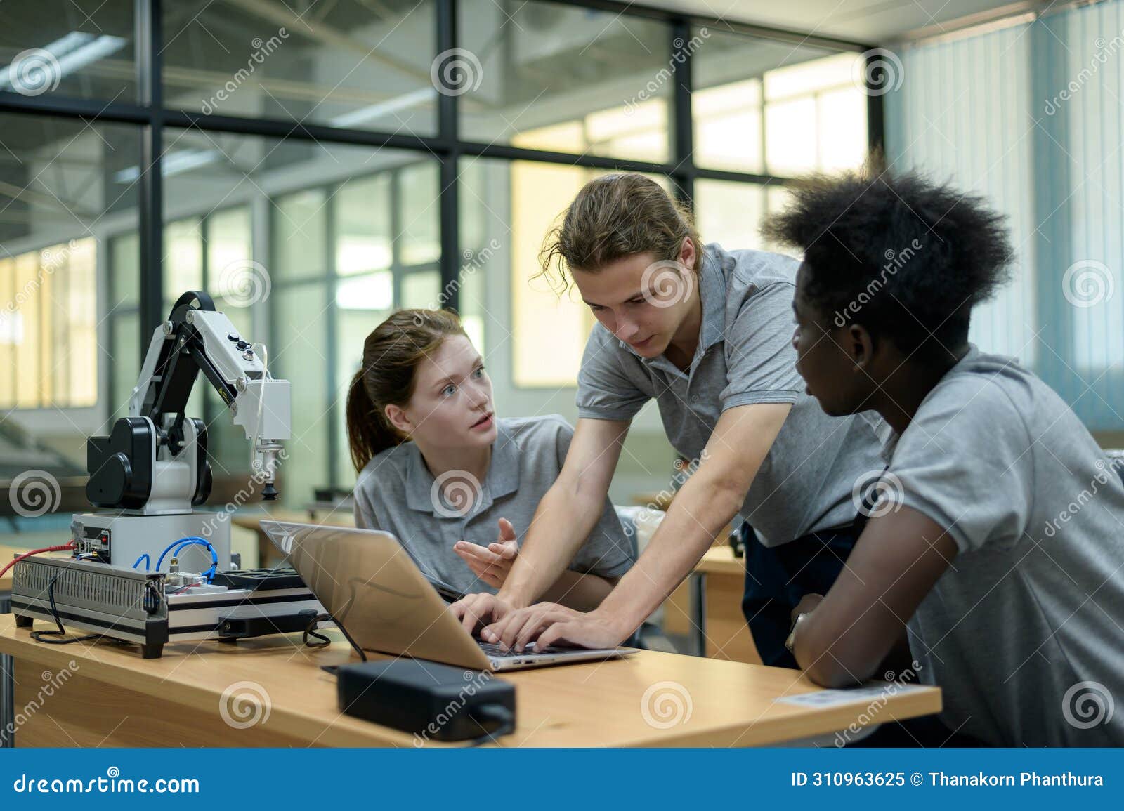 Trainee Robotics Engineer Learning with Programming and Manipulating ...