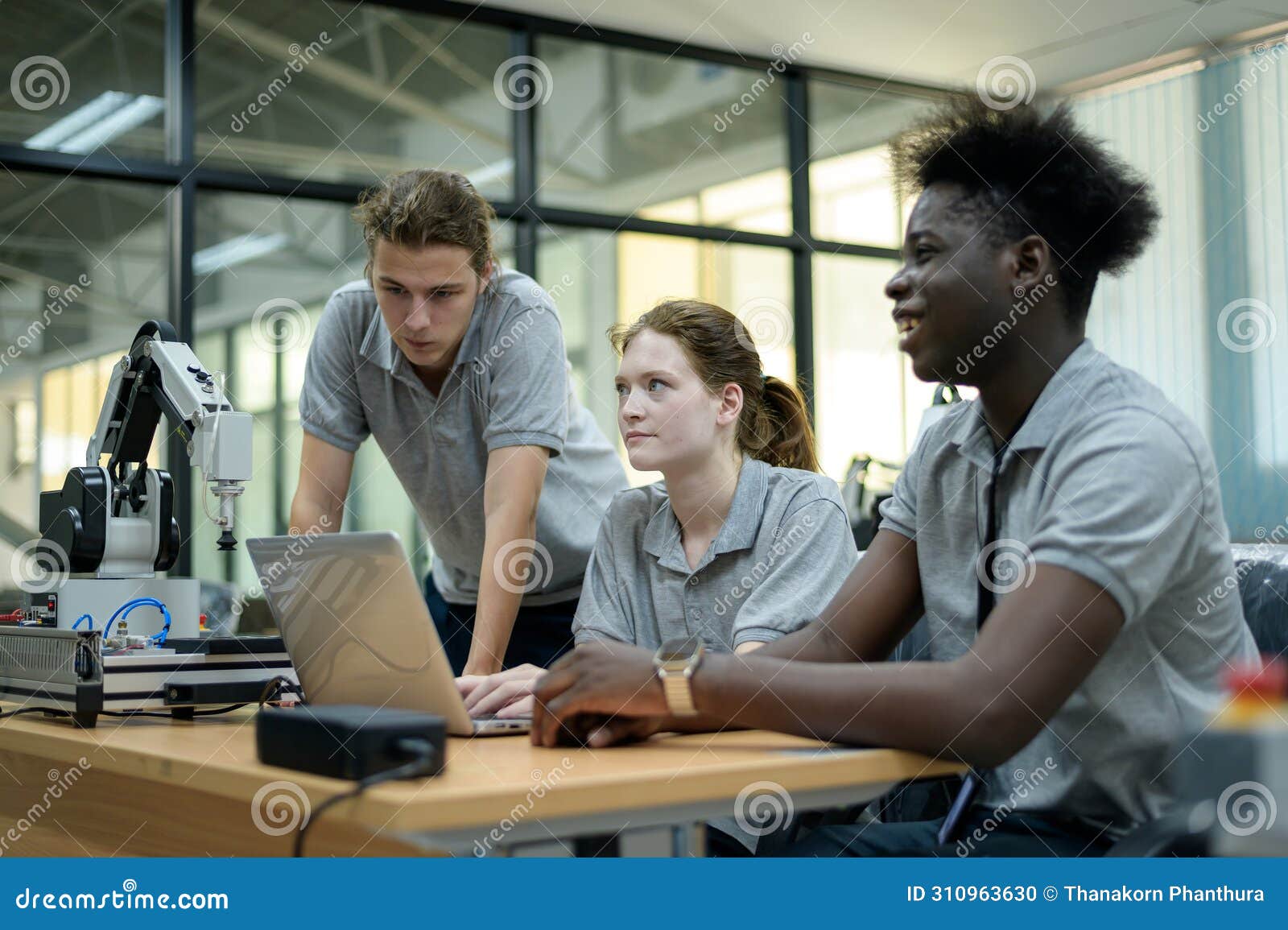 Trainee Robotics Engineer Learning with Programming and Manipulating ...