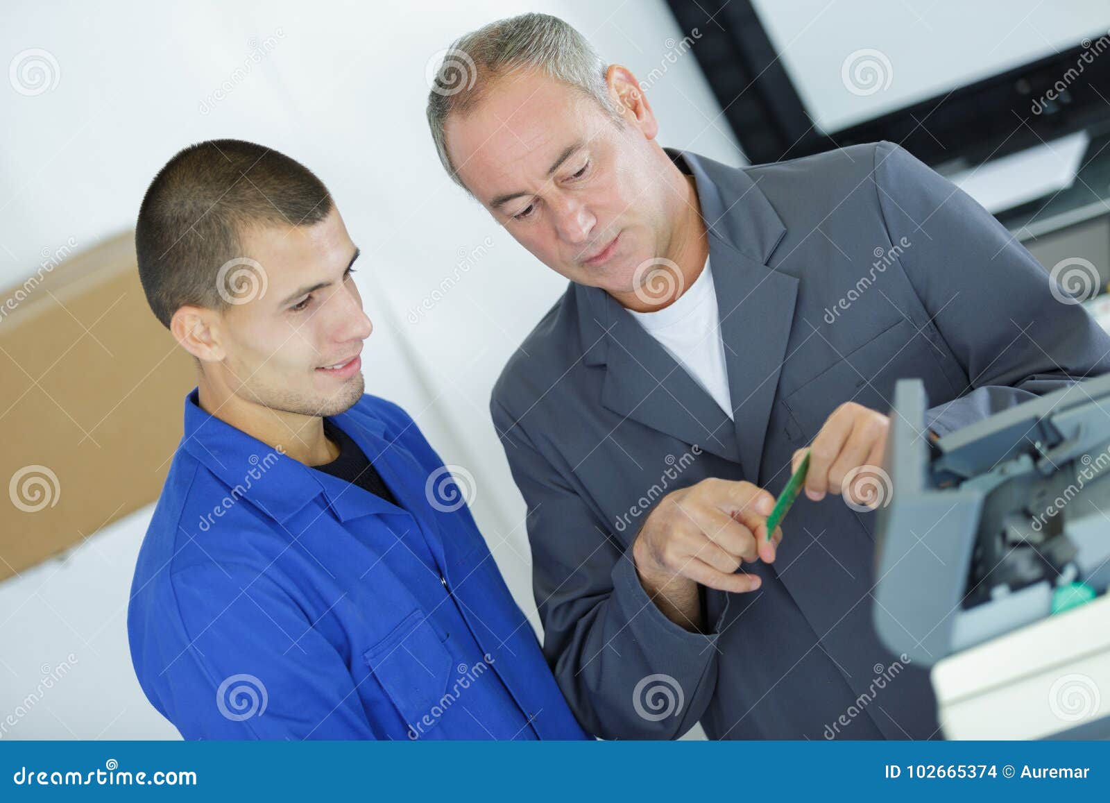 Trainee Technician Learning Trade with Mentor Stock Photo - Image of ...