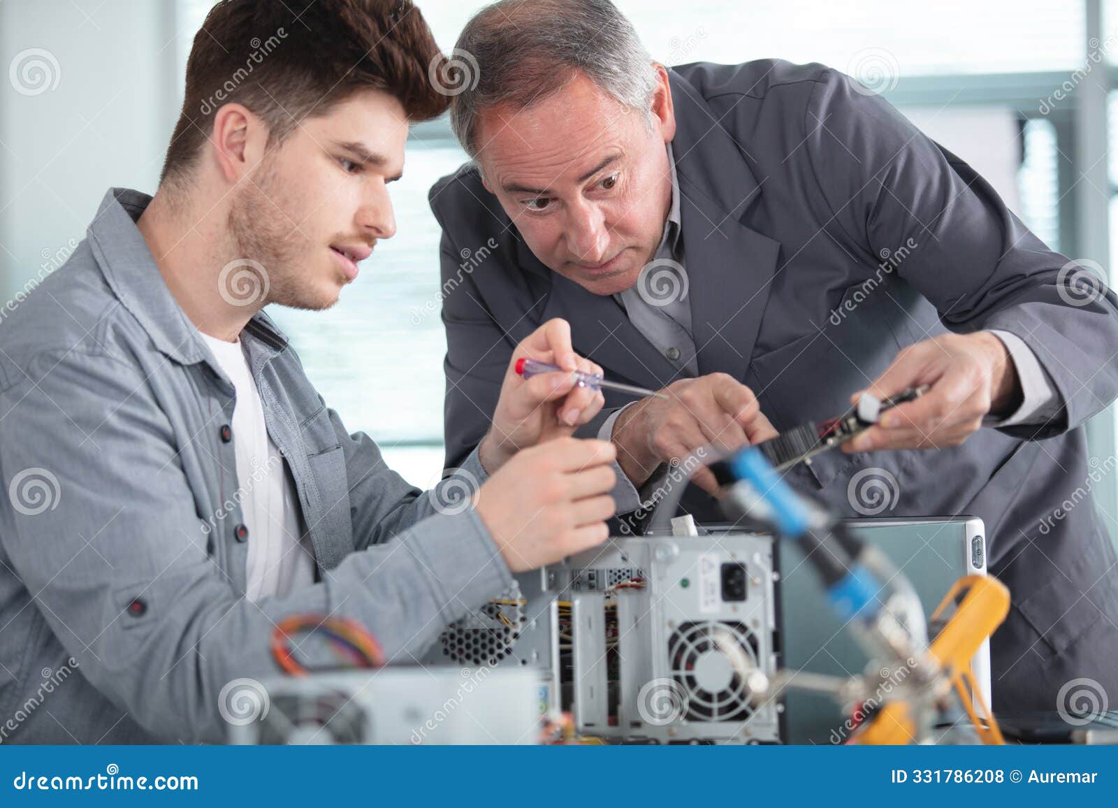 Trainee Technician Learning How To Wire Up Computer Stock Photo - Image ...