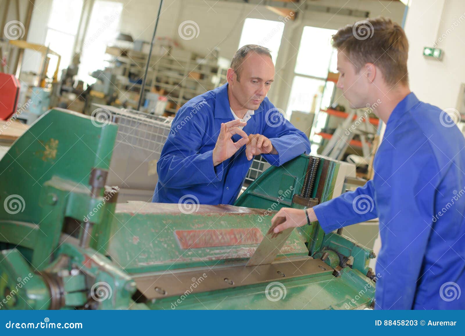 Trainee Using Machine Superviser Approving Work Stock Image - Image of ...