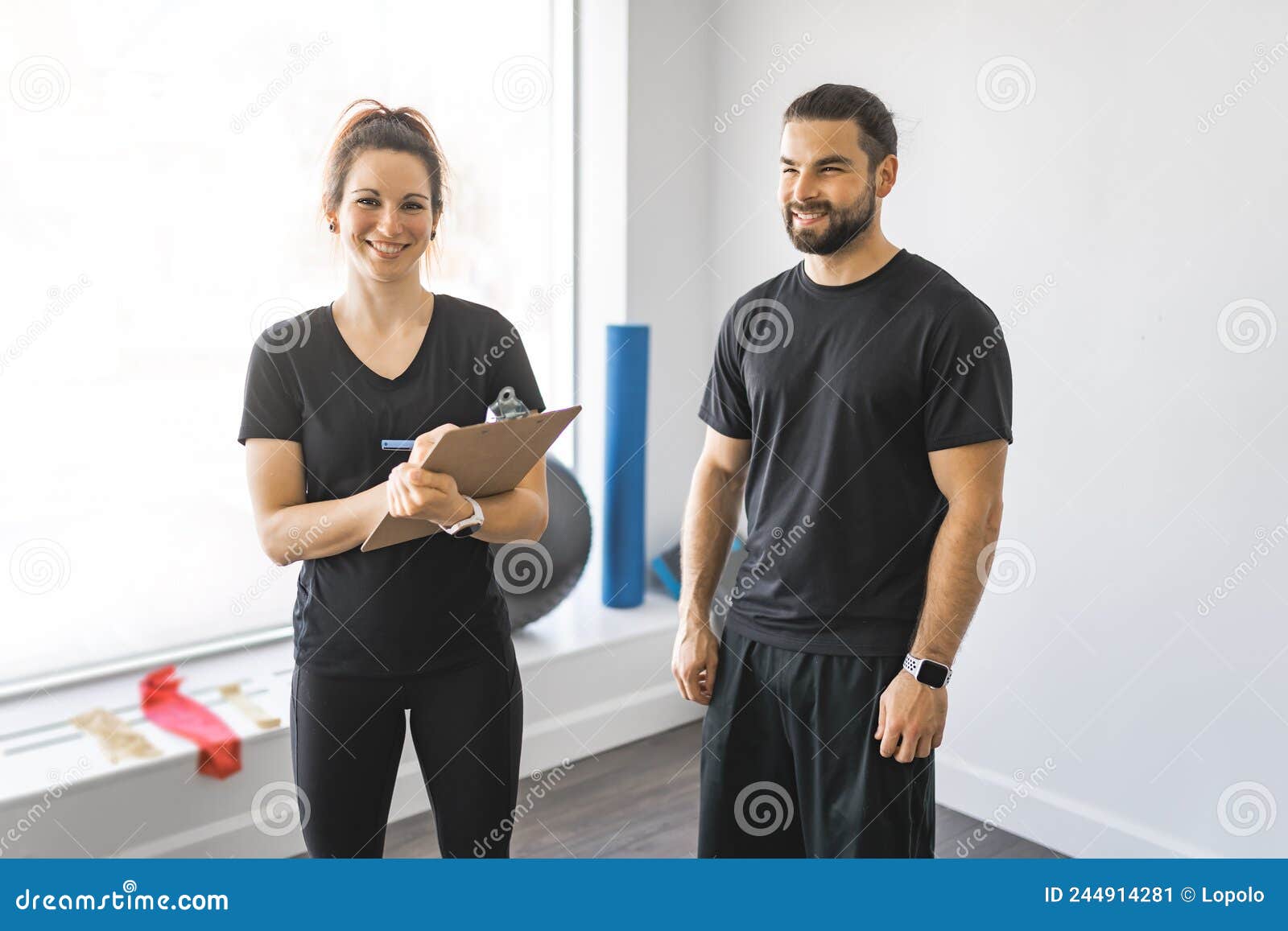 Trainer and Client Discussing Her Progress at the Gym Stock Image ...