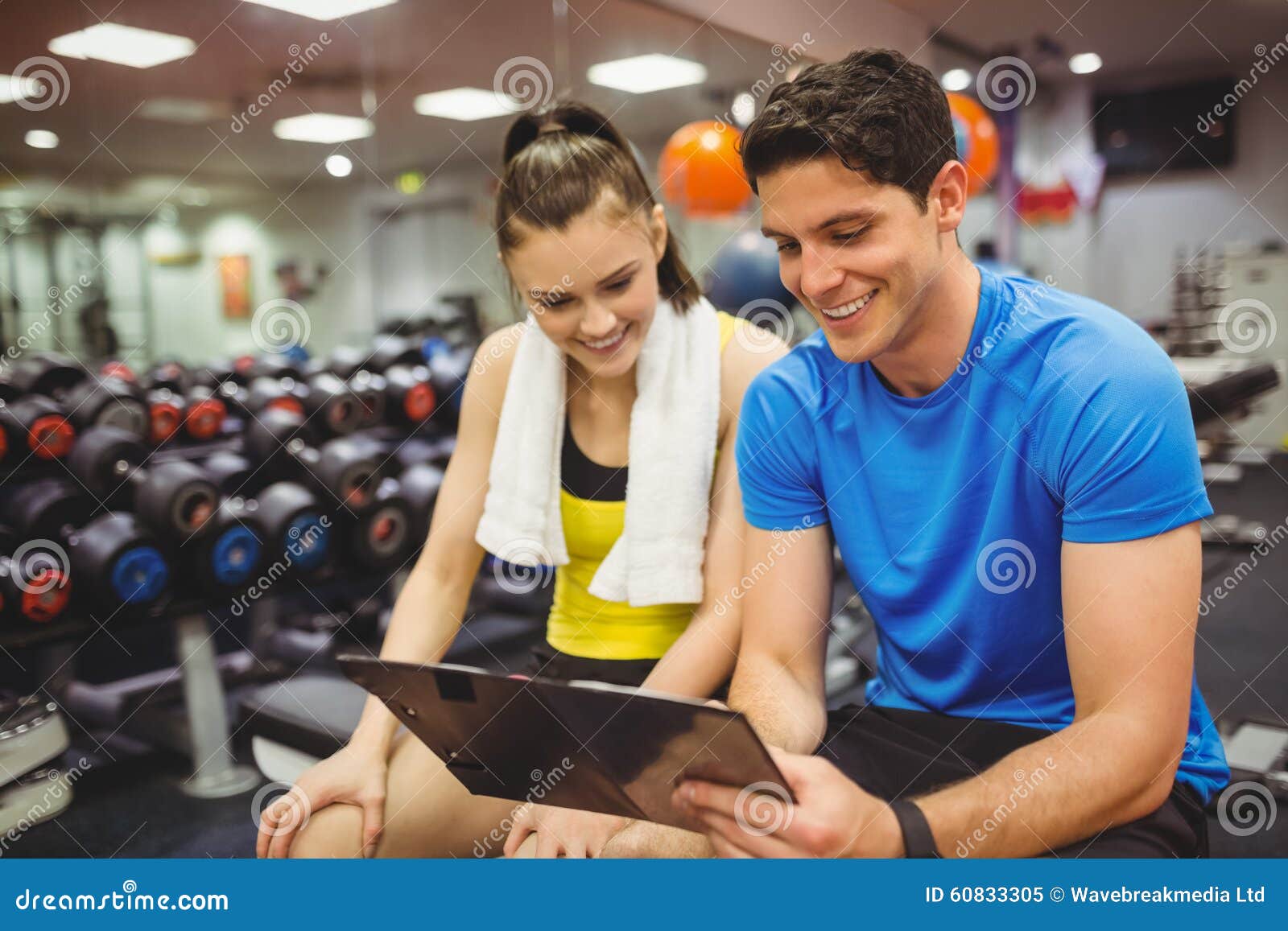 Trainer and Client Discussing Her Progress Stock Image - Image of ...