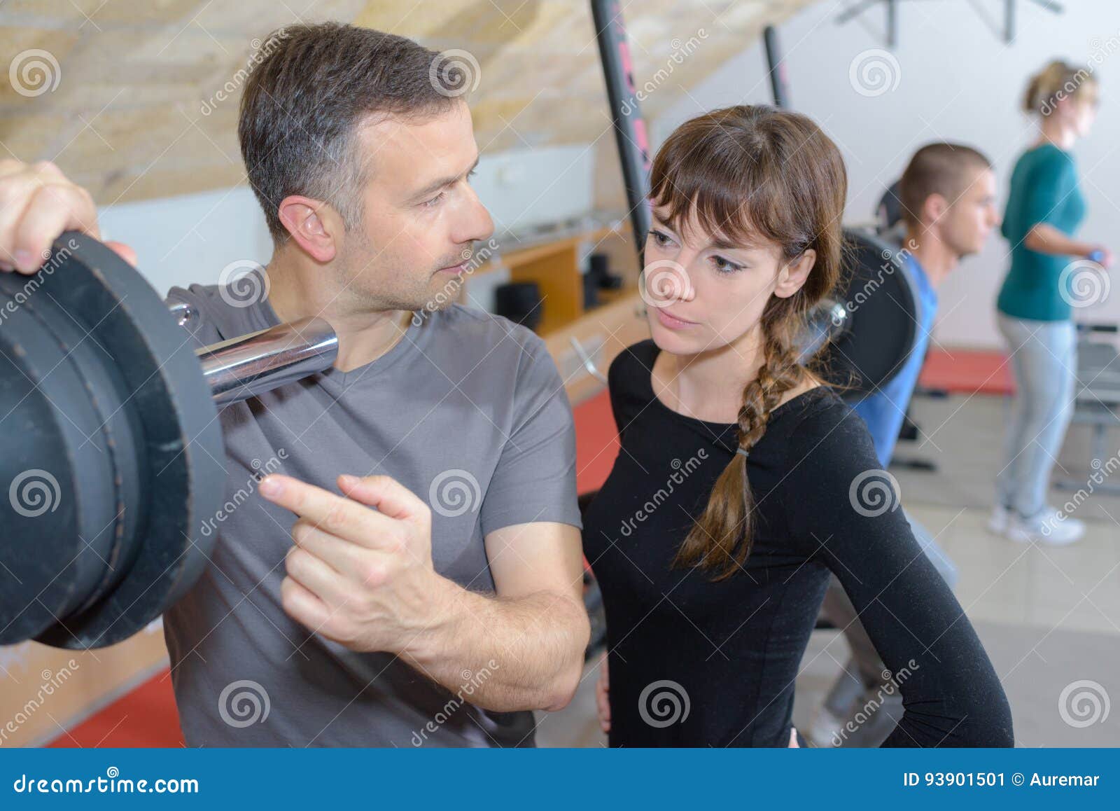Trainer Explaining How To Use Training Machine in Gym Stock Image ...