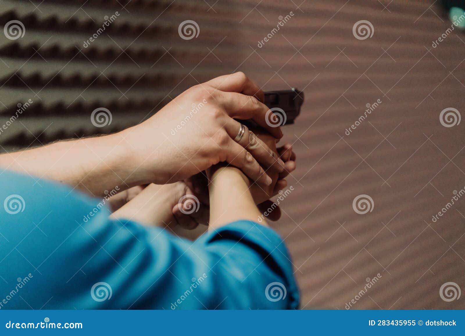 The Trainer Explaining To the Man How To Use the Gun. Training in the ...