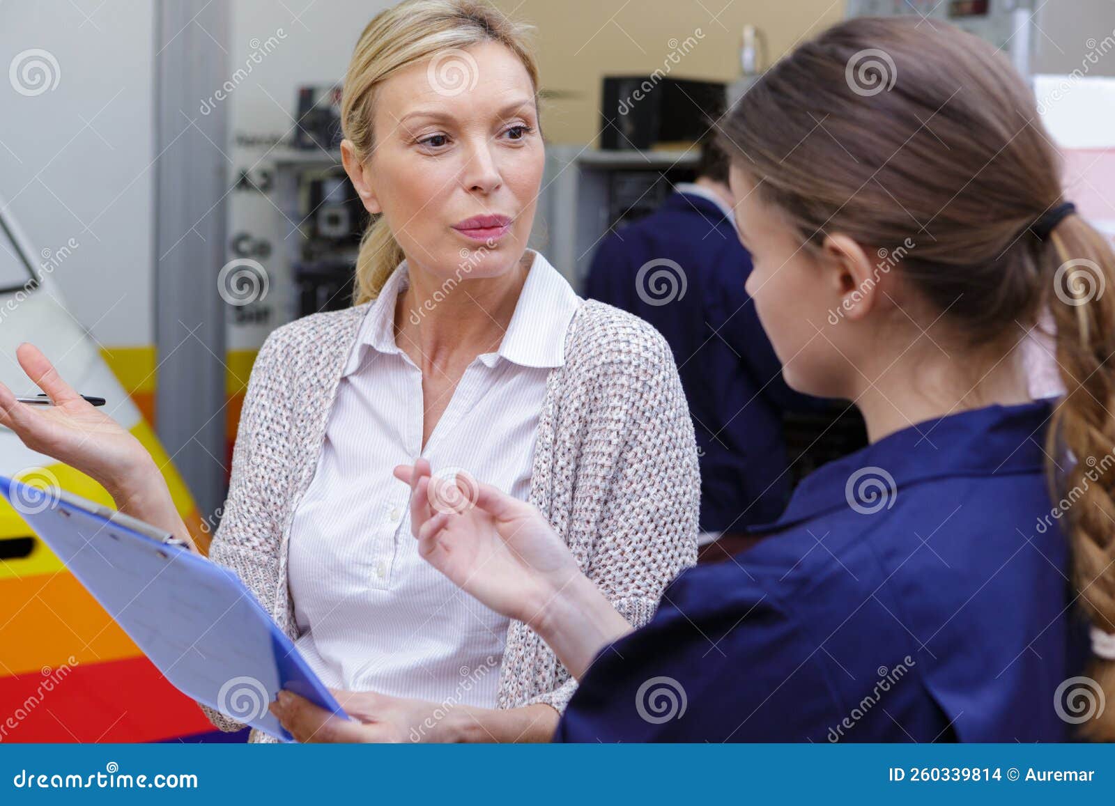 Trainer Having Conversation with Female Apprentice Stock Photo - Image ...