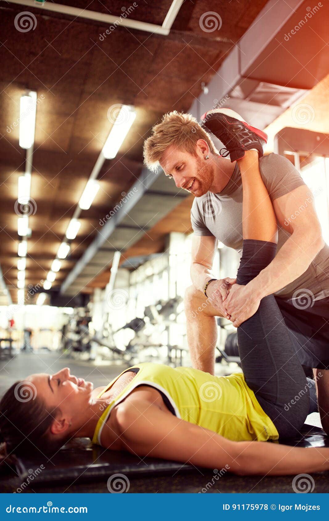 Trainer Help Girl in Exercises Stock Photo - Image of exercise, indoor ...