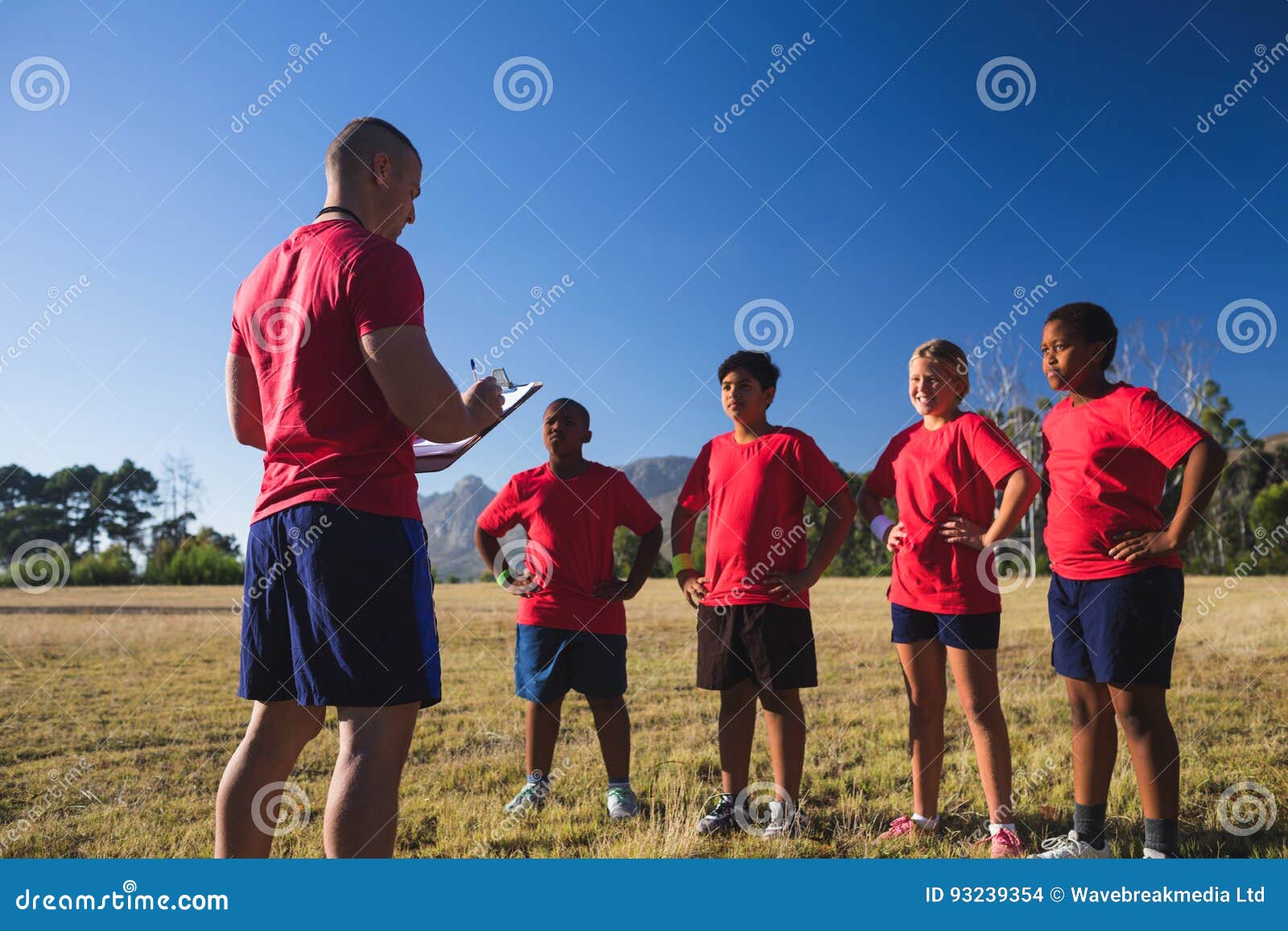 Trainer Instructing Kids in the Boot Camp Stock Photo - Image of male ...