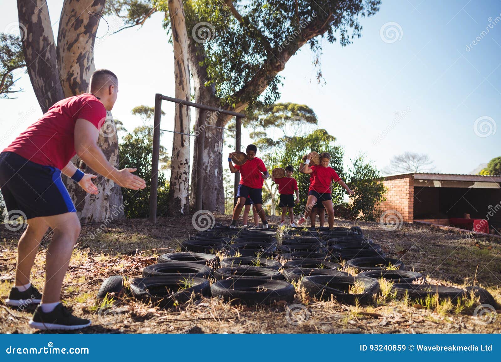 Trainer Instructing Kids during Obstacle Course Training Stock Image ...