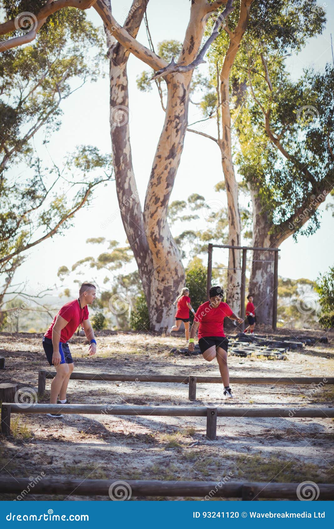 Trainer Instructing Kids during Obstacle Course Training Stock Photo ...