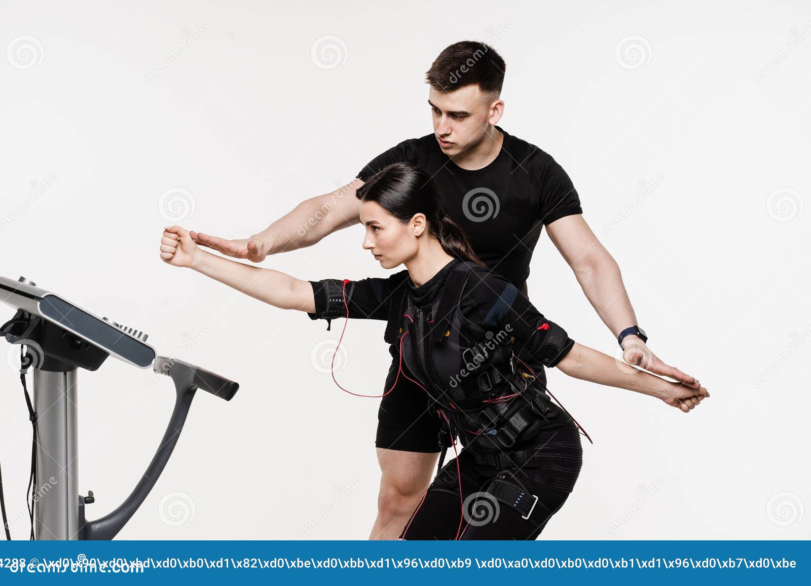 Trainer Shows an Example of the Exercise Using EMS Electrical Muscle ...