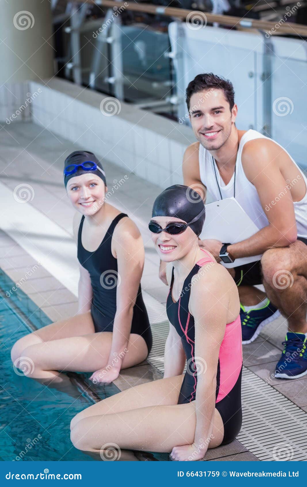 Trainer and Swimmers Smiling at the Camera Stock Image - Image of ...