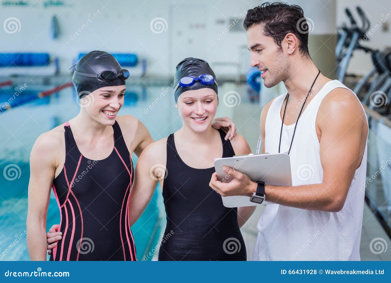 Trainer Talking with Smiling Swimmers Stock Photo - Image of attractive ...
