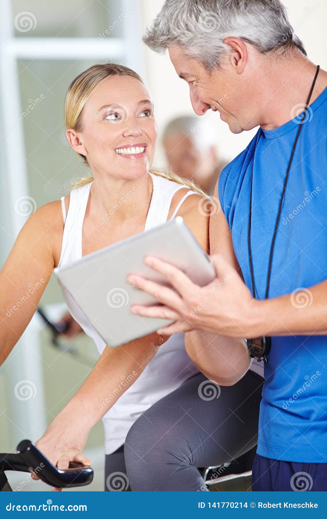Trainer Using Tablet Computer in the Fitness Center Stock Photo - Image ...