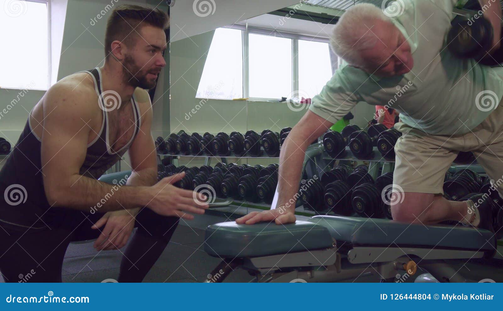 Trainer Watching How Senior Client Does Exercises Stock Photo - Image ...