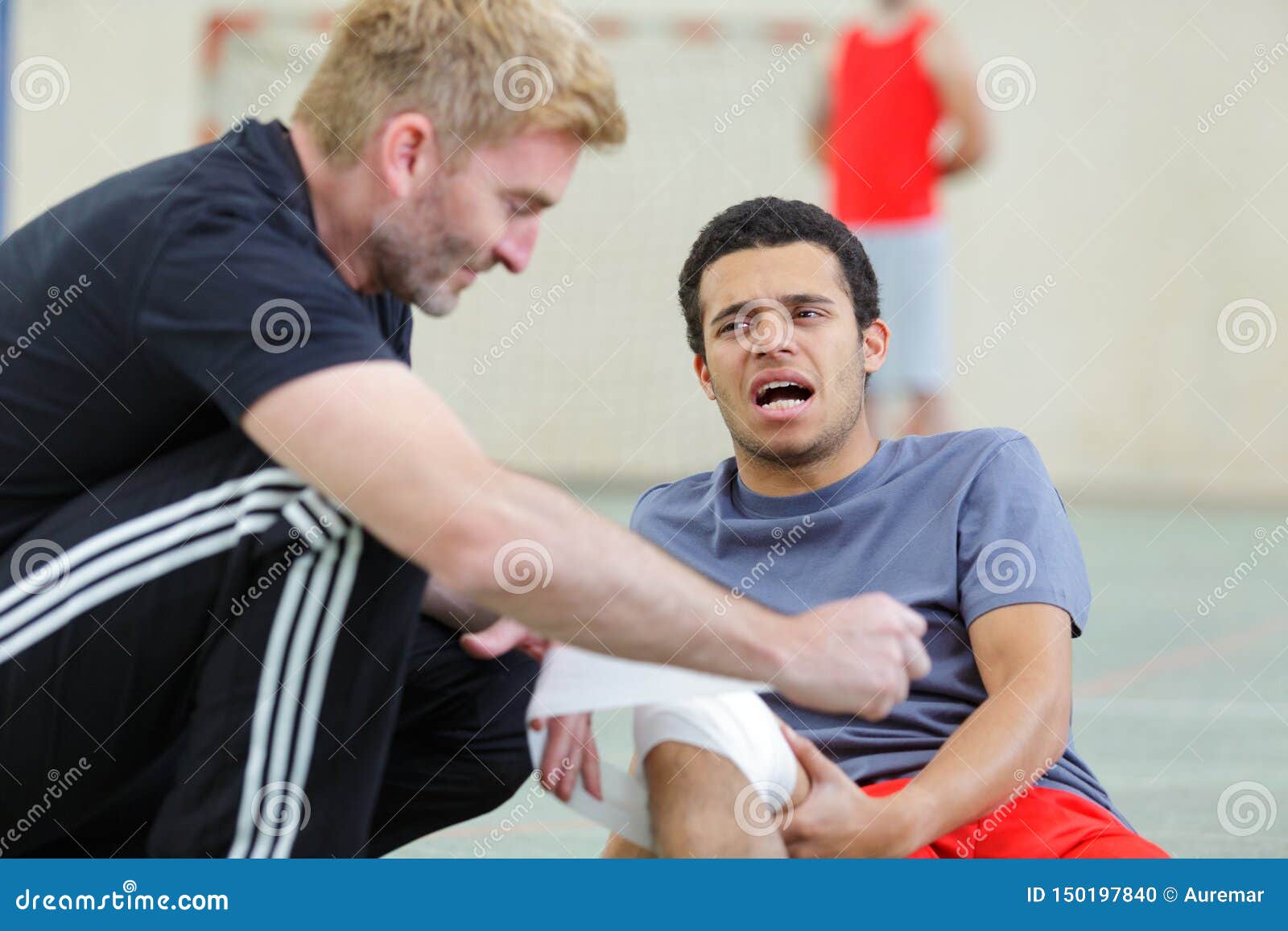 Trainer Wrapping Injured Player Leg Stock Photo - Image of rest, club ...