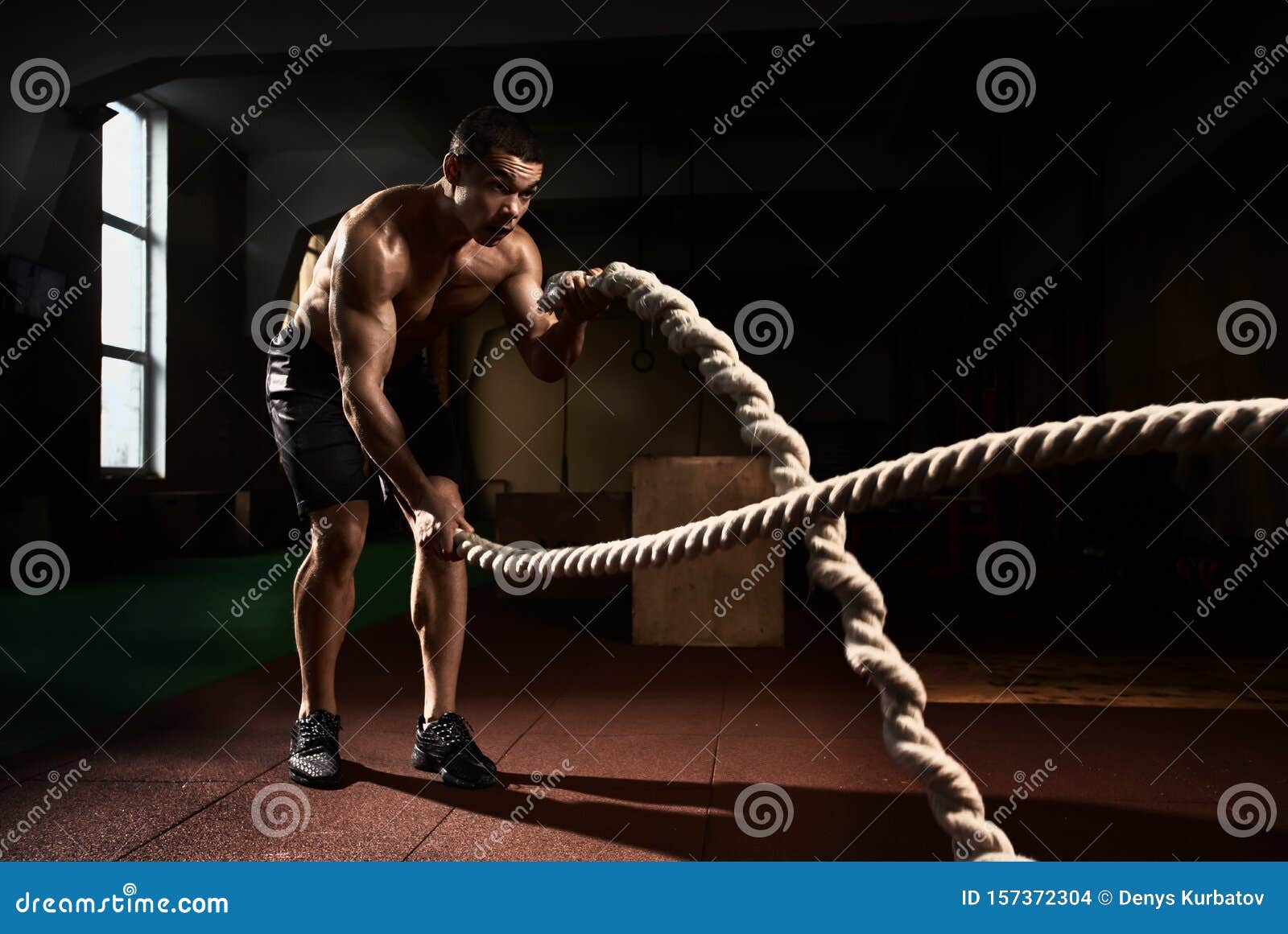 Training with battle rope stock photo. Image of male - 157372304