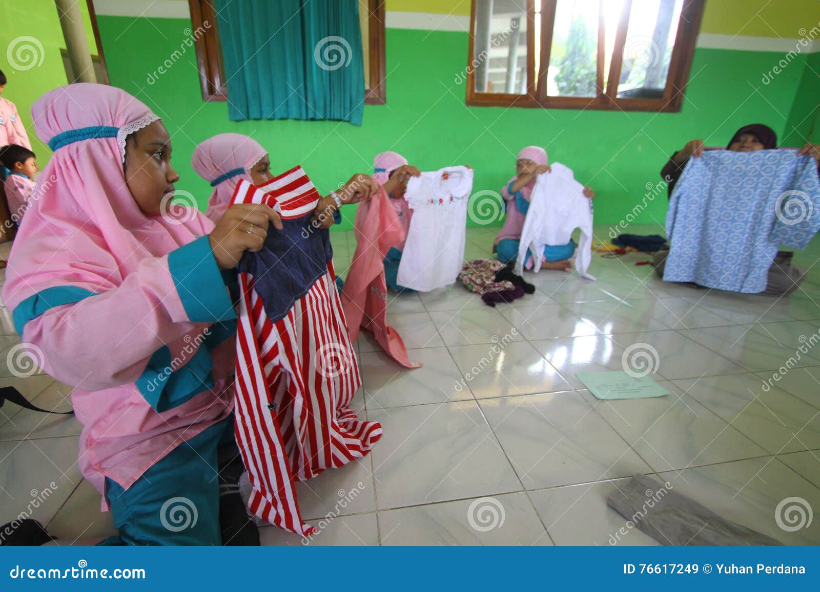 Training Folding Clothes editorial stock image. Image of java - 76617249