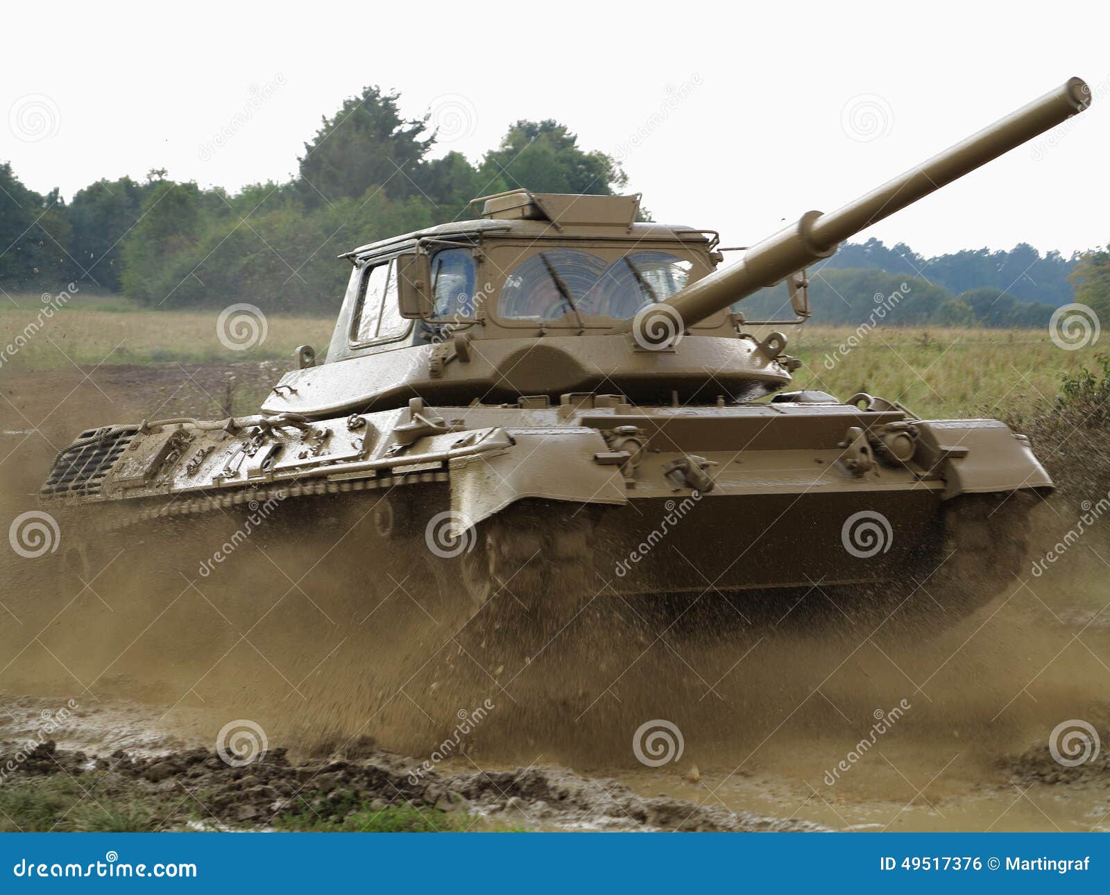 Training tank in action stock photo. Image of muddy, rough - 49517376