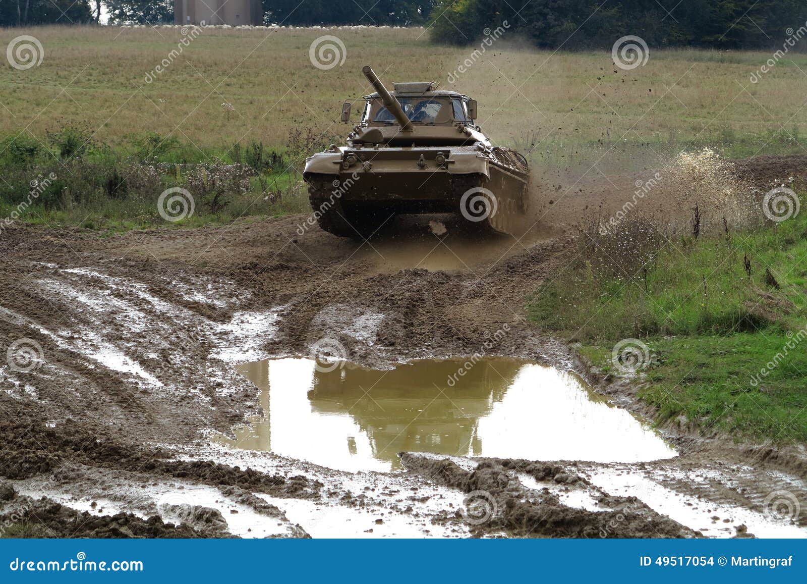 Training Tank Speeding into Muddy Puddle Stock Photo - Image of ...