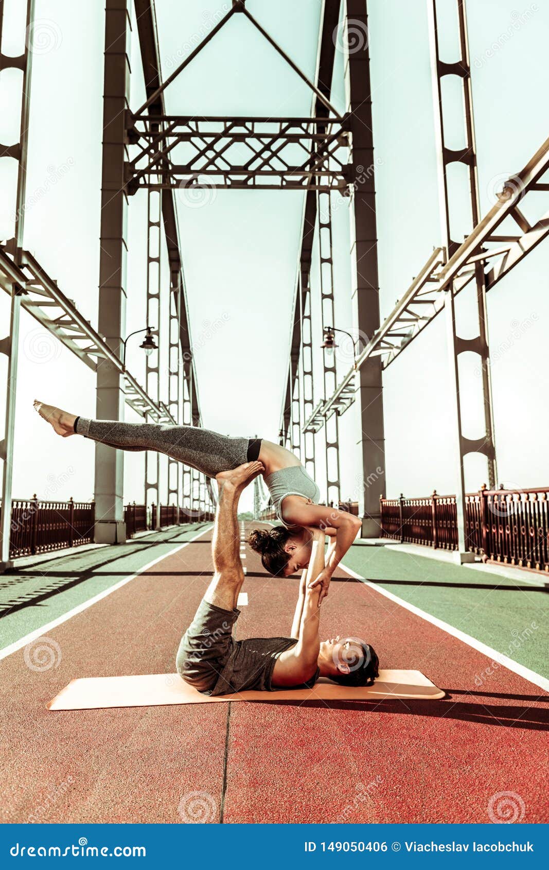 People Doing an Acrobatic Exercise on a Pedestrian Bridge Stock Photo ...