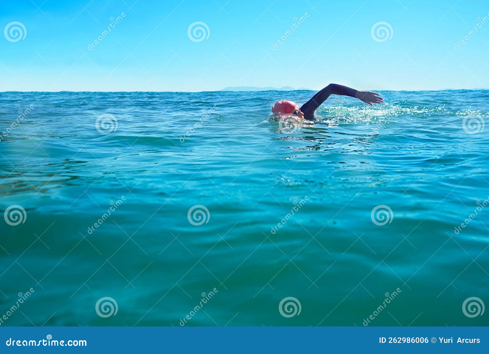 Training Wherever Theres Water. a Swimmer in the Open Ocean. Stock ...