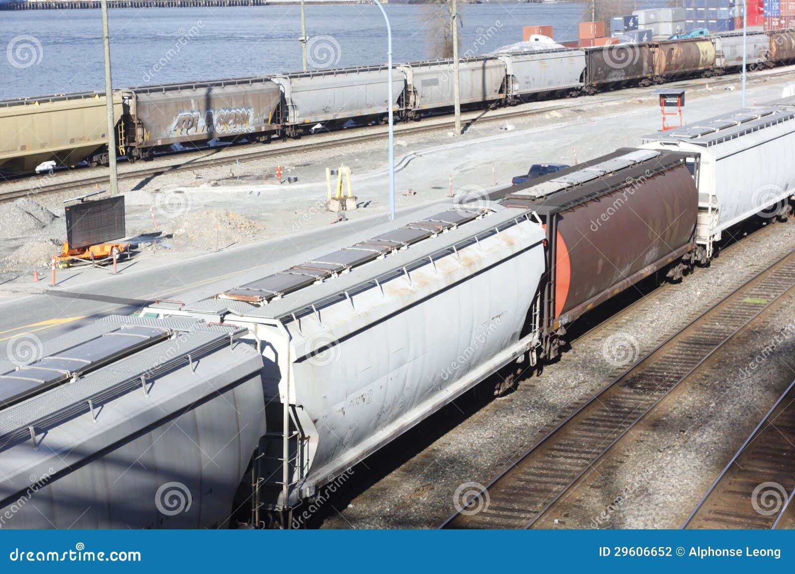 Trains Resting by the Water Stock Photo - Image of industrial, tracks ...