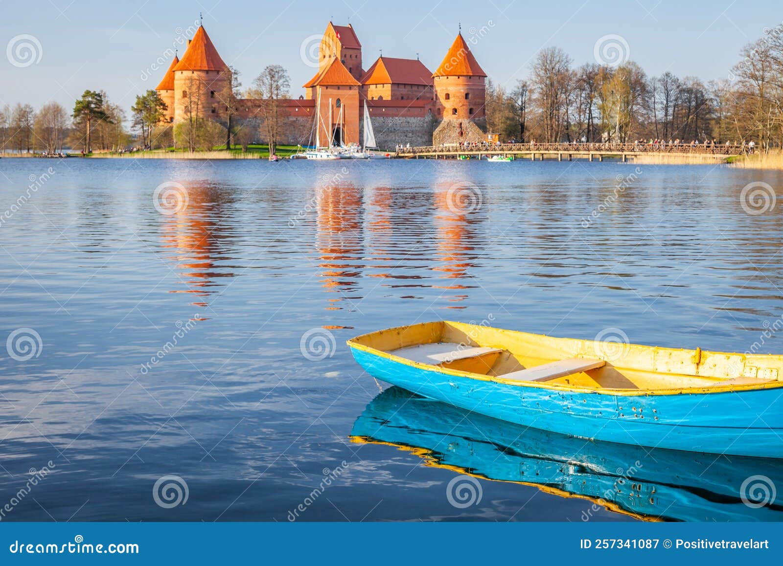 Trakai Castle with Boat Floating on Water in Foreground, Lithuania ...