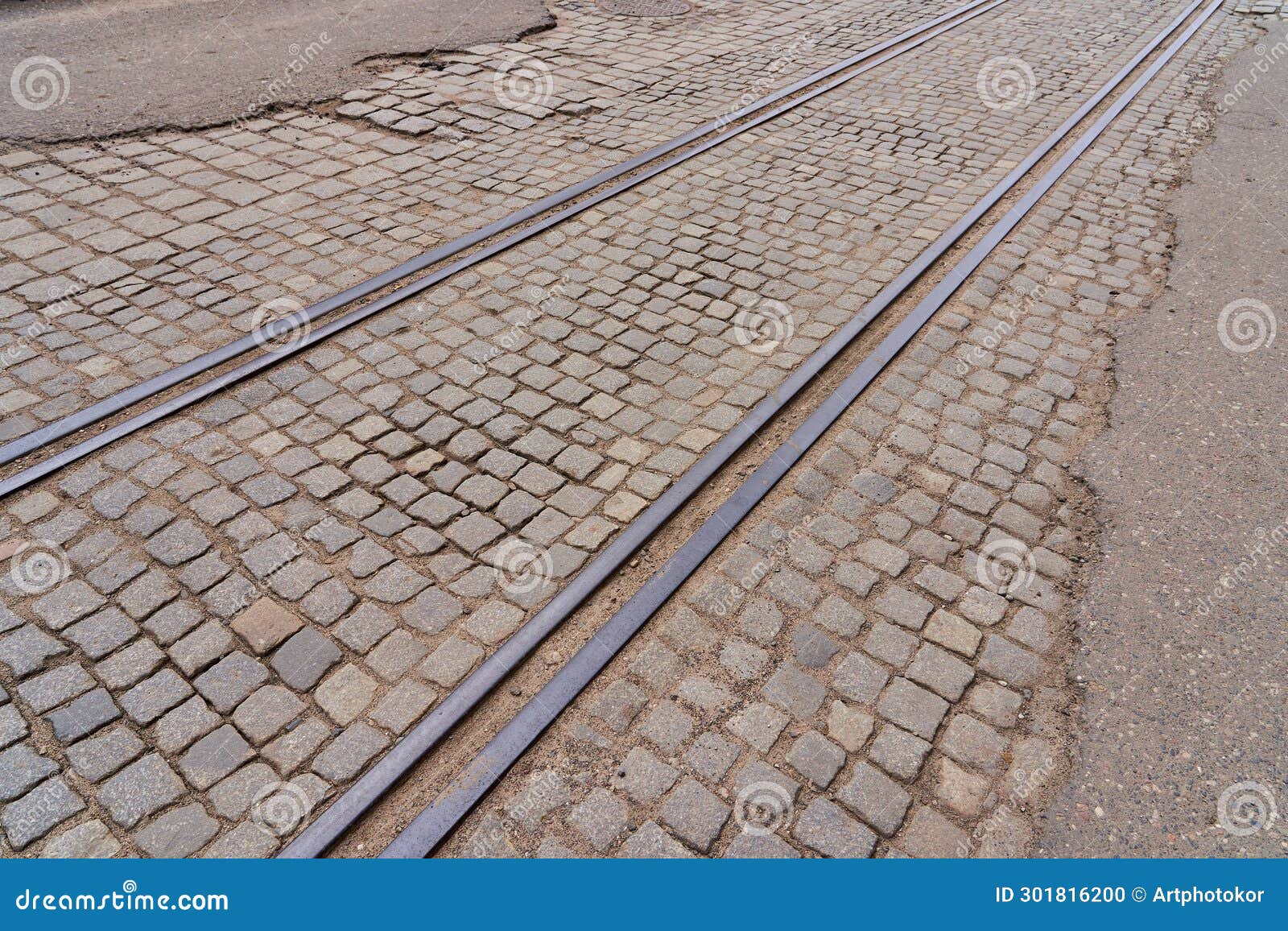Tram Tracks on the Background of Paving Stones in Close-up Stock Photo ...