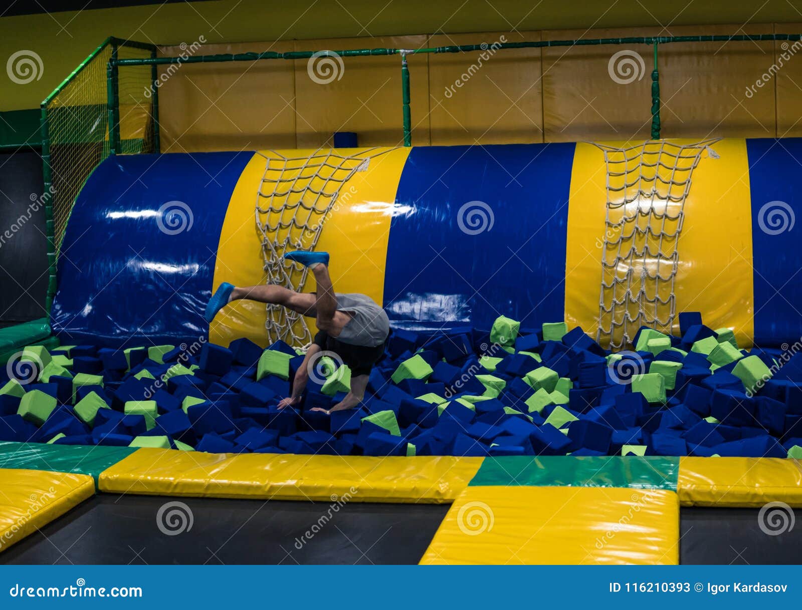 Trampoline Jumper Performs Acrobatic Exercises on the Trampoline Stock ...