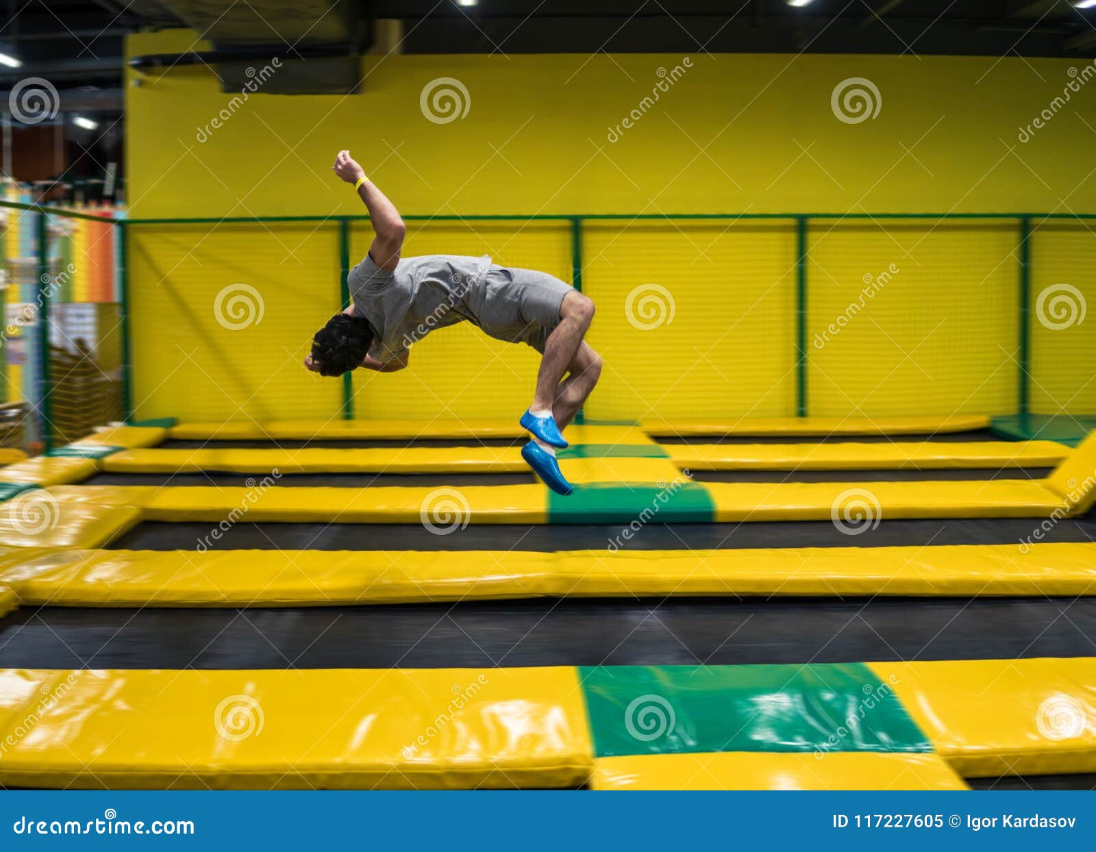 Trampoline Jumper Performs Acrobatic Exercises on the Trampoline Stock ...
