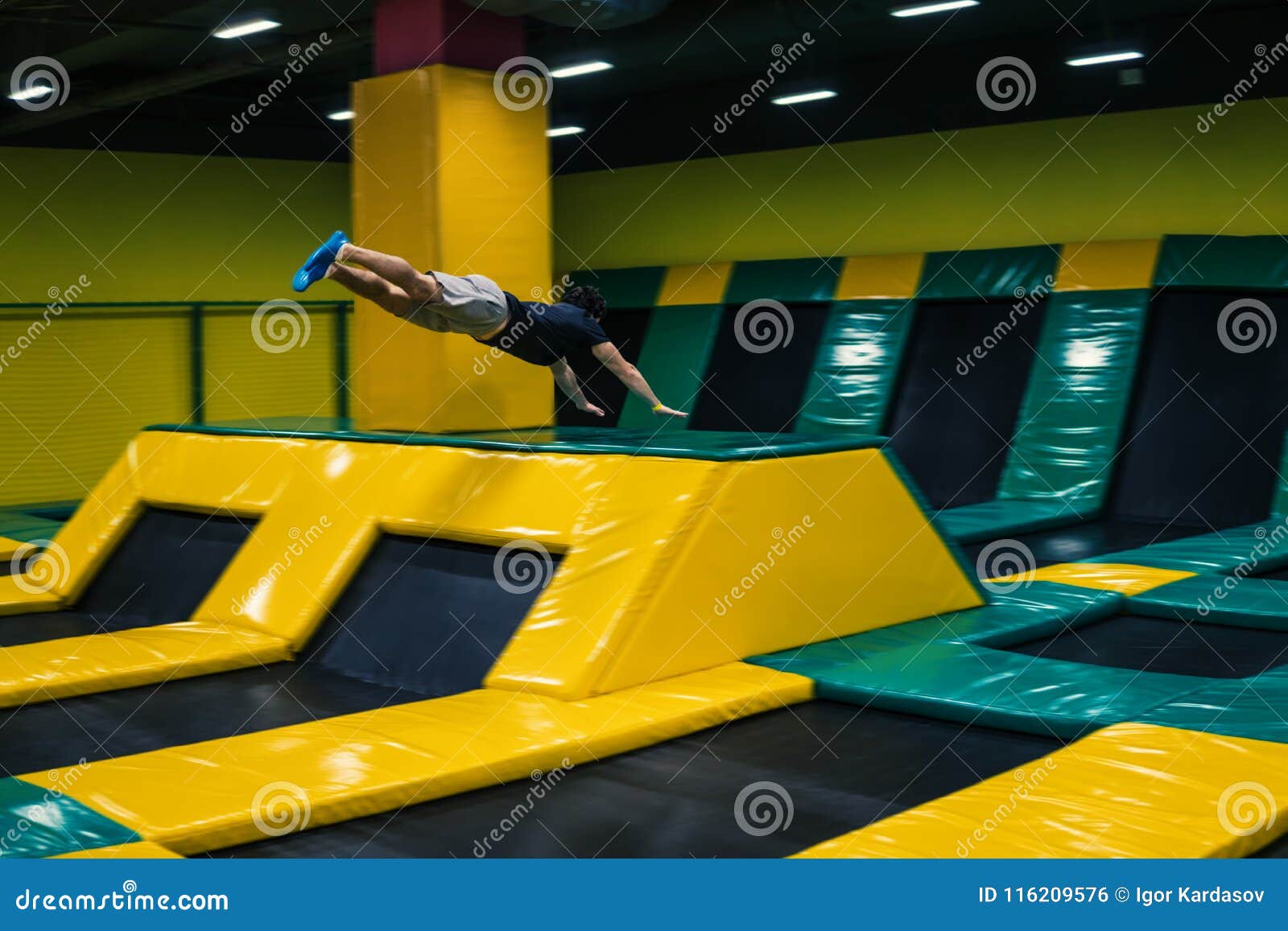 Trampoline Jumper Performs Acrobatic Exercises on the Trampoline Stock ...