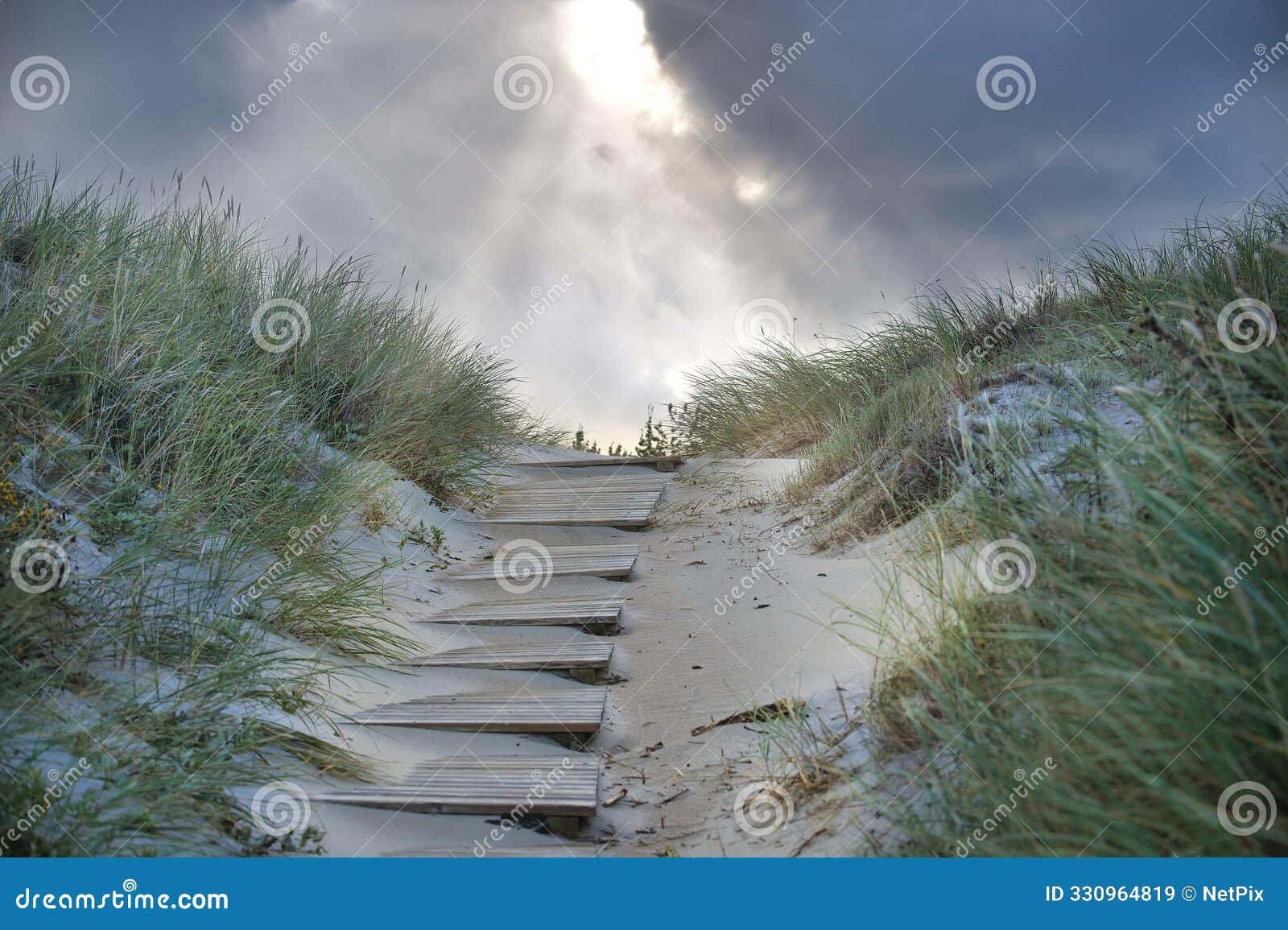 Tranquil Beach Pathway through Sandy Dunes with Dramatic Sky and Sun ...