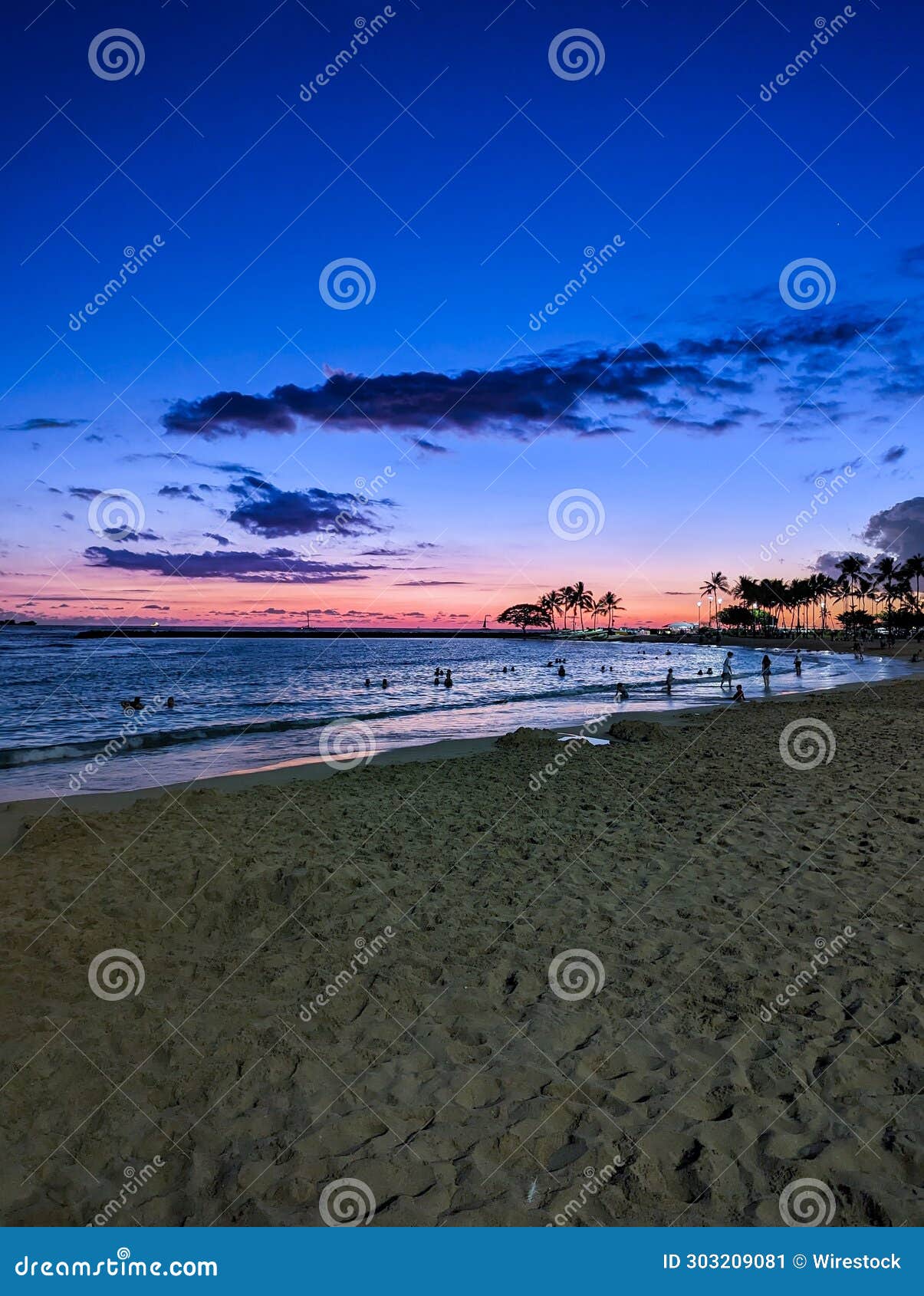 A Beach Scene with the Sun Setting in the Background and Palm Trees ...