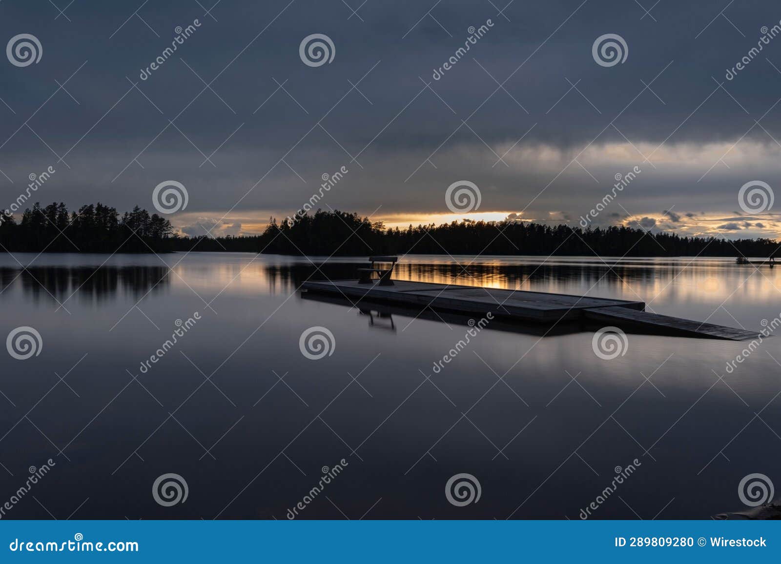 Tranquil Lake is Surrounded by a Dark Sky and Billowing Clouds. Stock ...