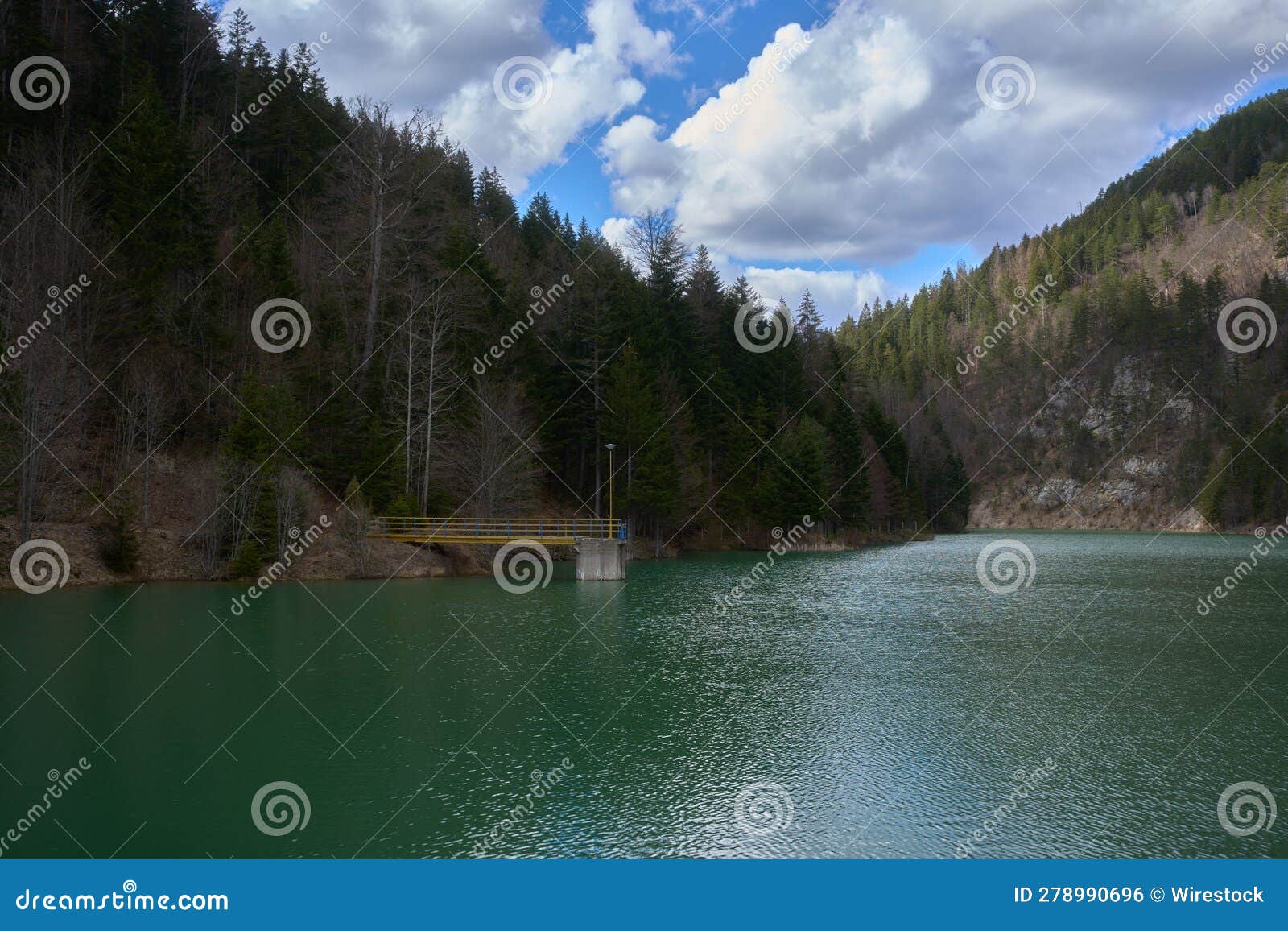 Tranquil Lake Surrounded by Mountains Covered in Evergreen Trees. Stock ...