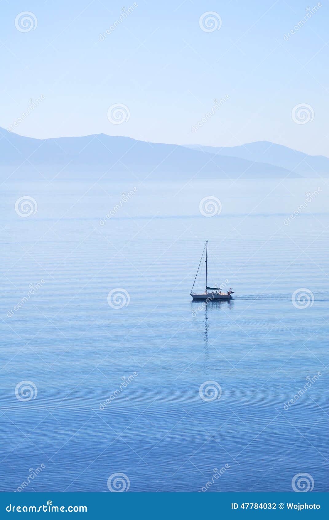 Tranquil Morning Sea with a Sailing Ship Stock Photo - Image of haze ...