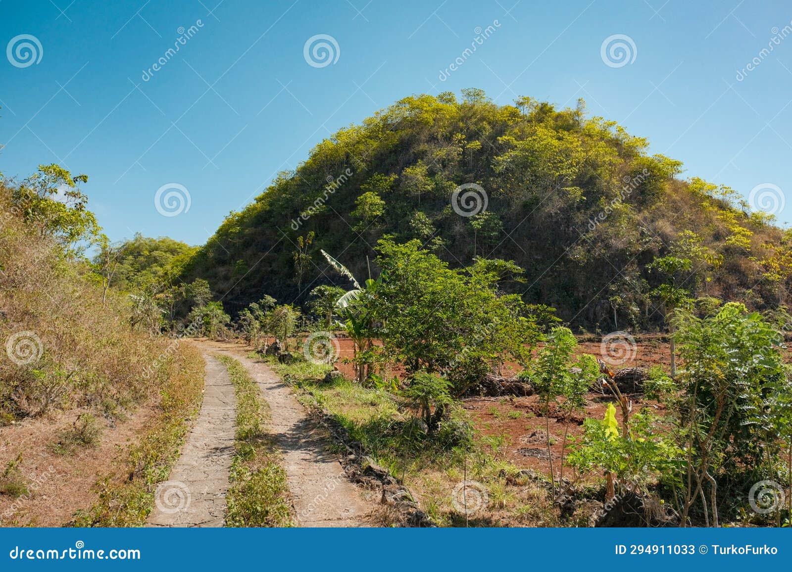 Tranquil Path in Indonesia, Framed by Hills and Two-Lane Motorcycle ...