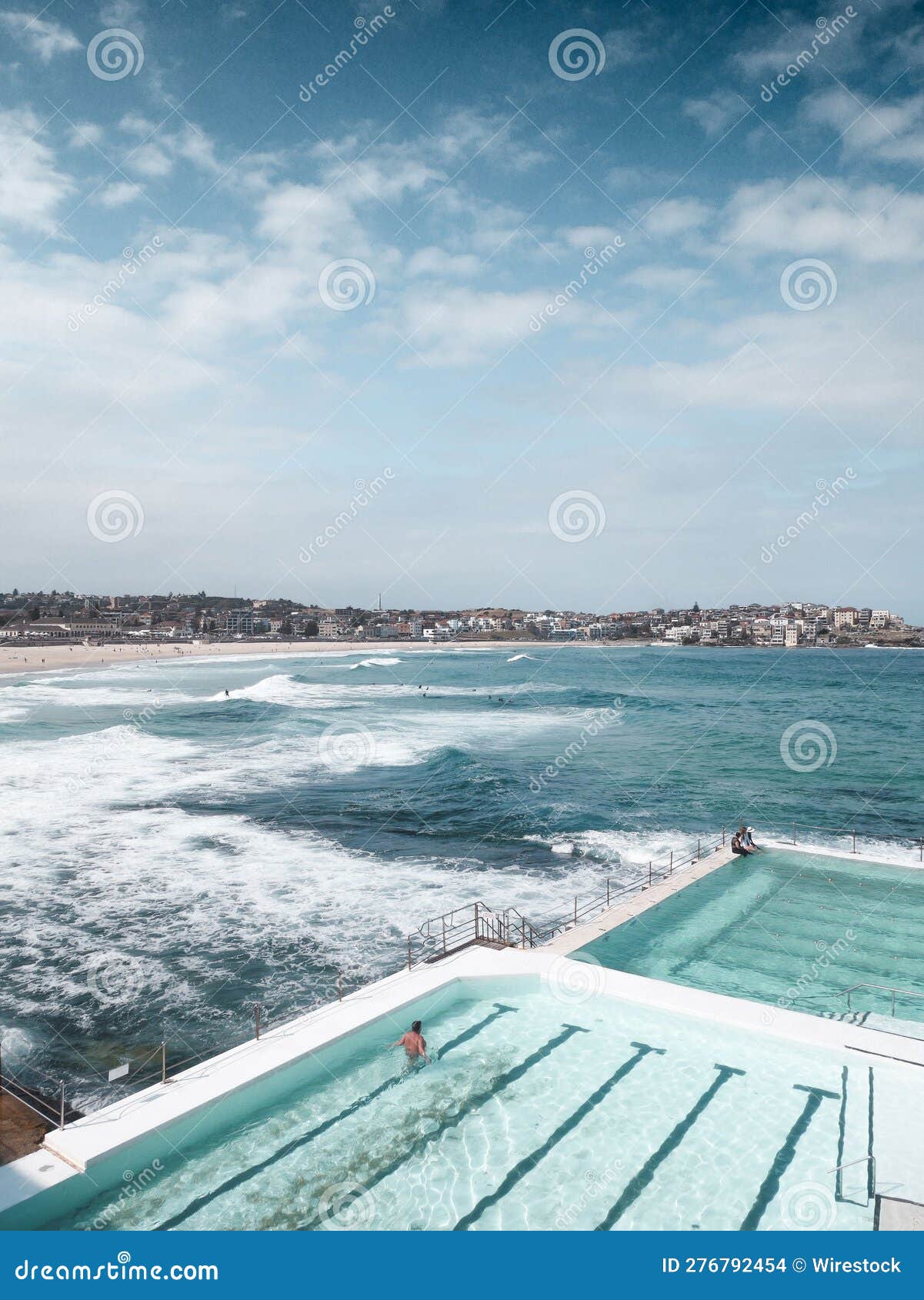 Tranquil Pool Against the Backdrop of the Vast and Restless Ocean, the ...
