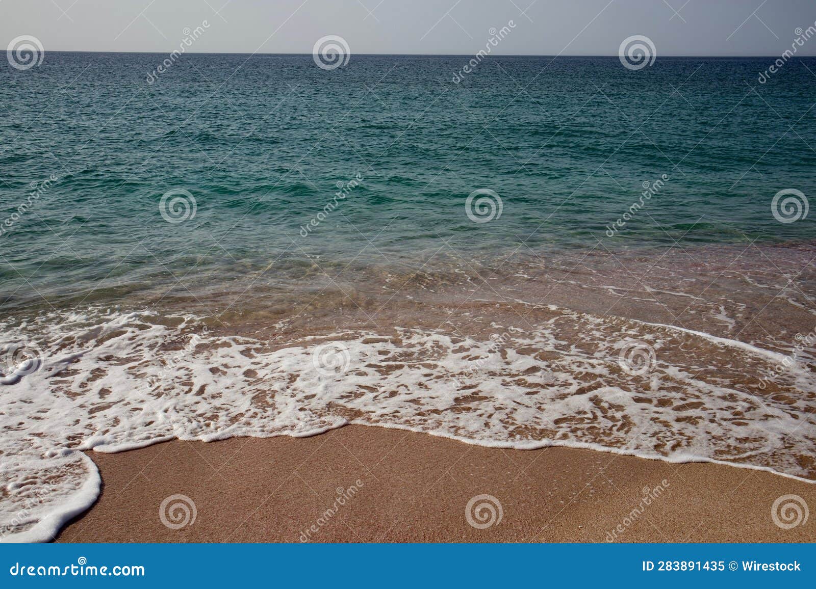 Tranquil Sandy Beach Scene with Calm Waves Stock Image - Image of ...