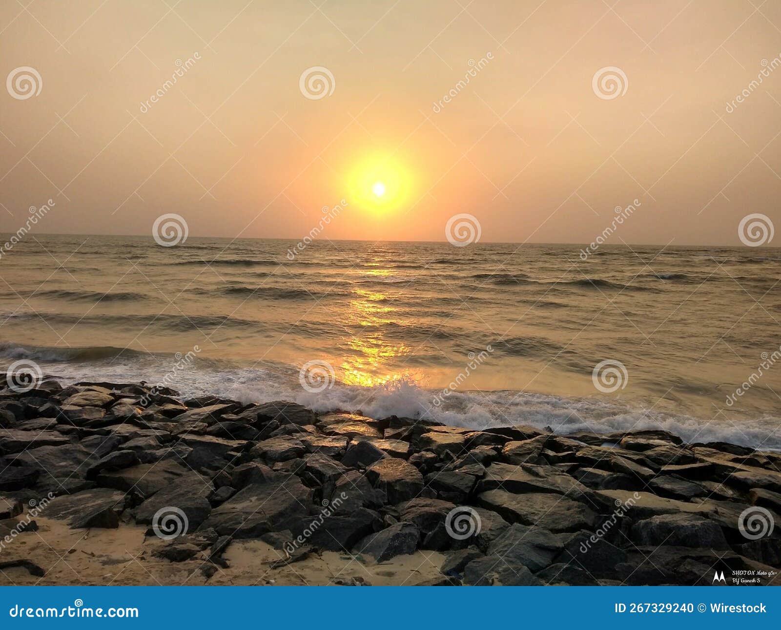 Tranquil Scenery of an Empty Beach with Gentle Waves Lapping at the ...