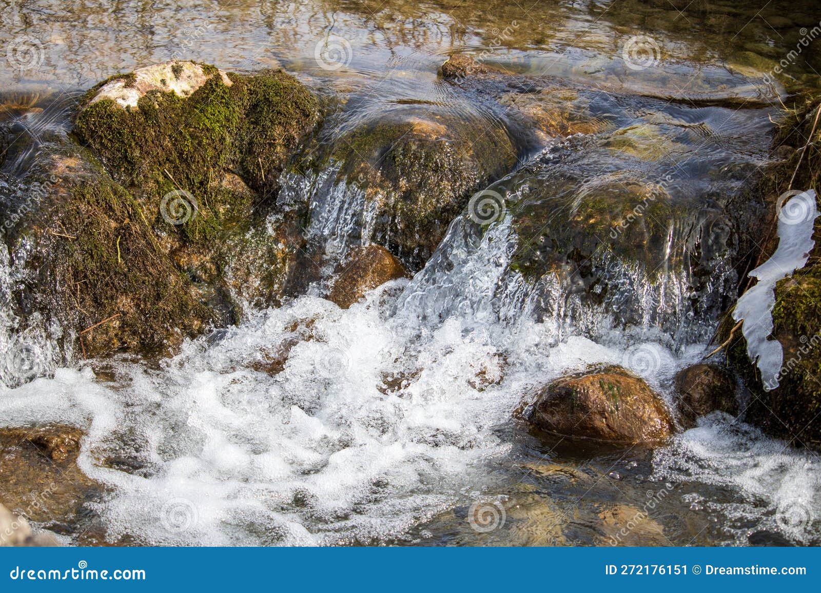 A Stream Flows through Some Large Rocks in the Forest Stream Stock ...