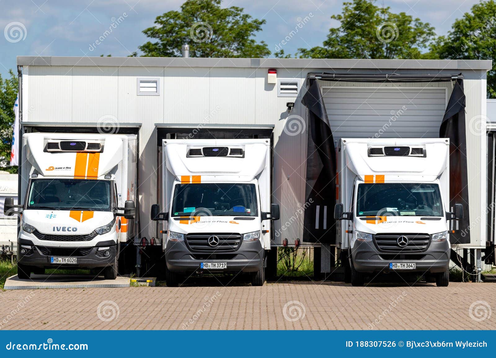 Trans-o-flex delivery vans editorial photo. Image of center - 188307526