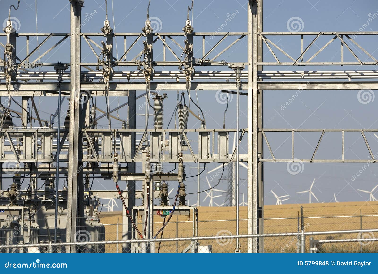 Transformer Yard Wth Wind Turbines in Background Stock Photo - Image of ...