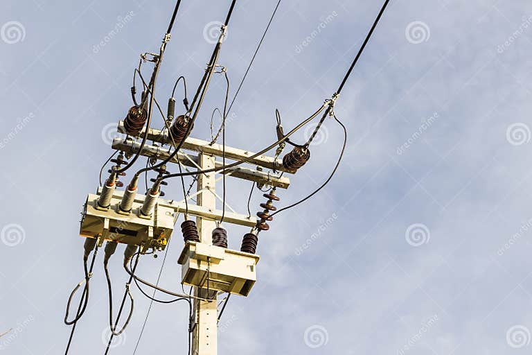 Transformers of an Electrical Post Against Twilight Blue Sky Background ...