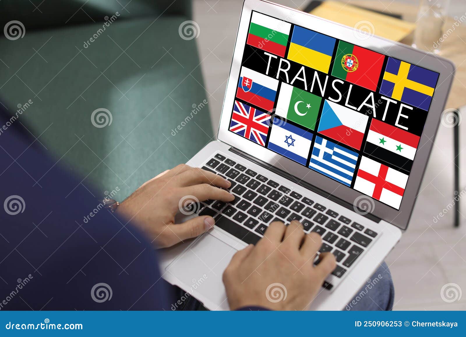 Translator Using Laptop with Images of Different Flags on Screen in ...
