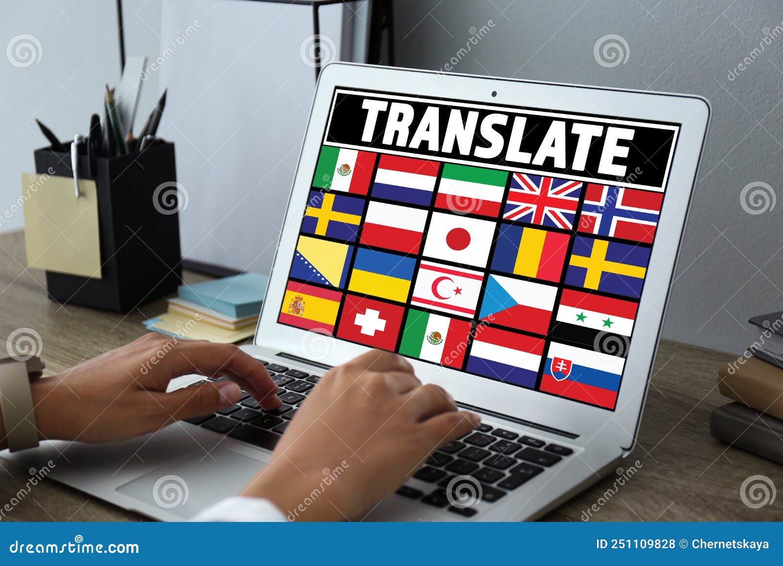 Translator Using Modern Laptop with Images of Different Flags on Screen ...