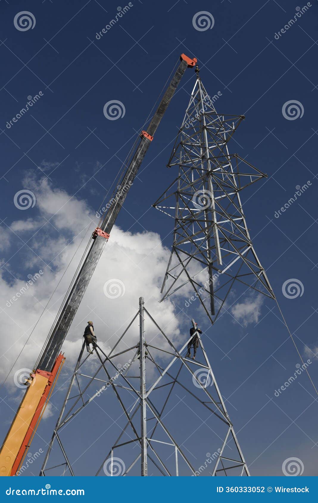 Transmission Tower Assembly with Crane Under Blue Sky. Stock Photo ...