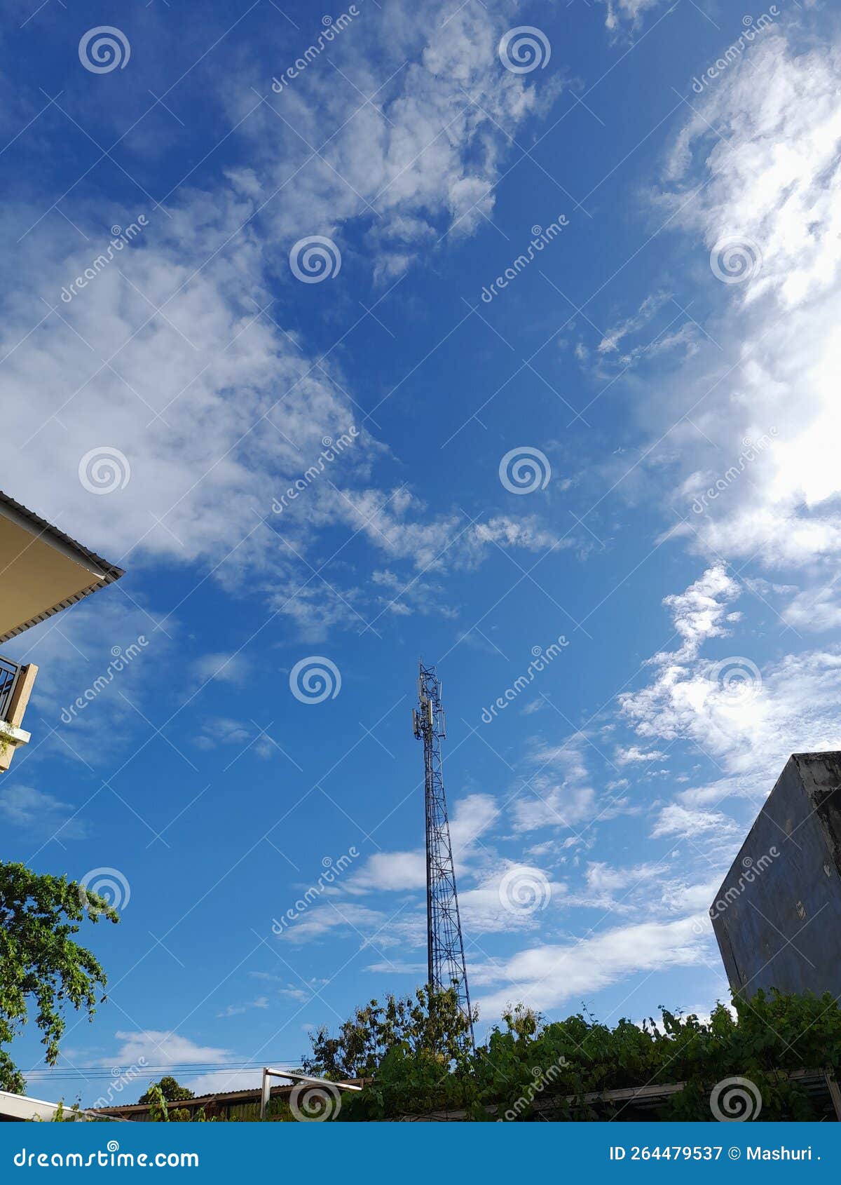 Transmitter Tower with a Background of Blue Sky and Clouds Stock Image ...